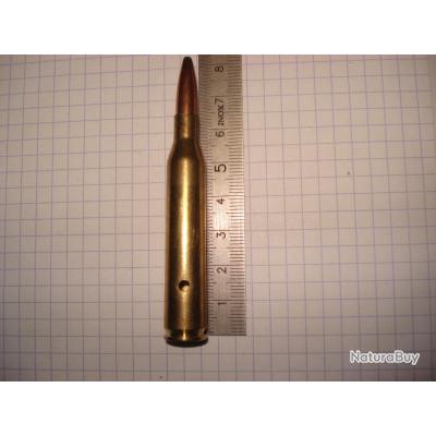 Une cartouche de 25.06 remington neutralisée, amorce percutée, étui ...